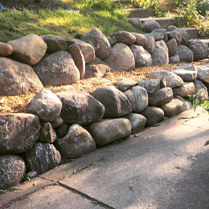 Fieldstone retaining wall - Hothouse Horticulture